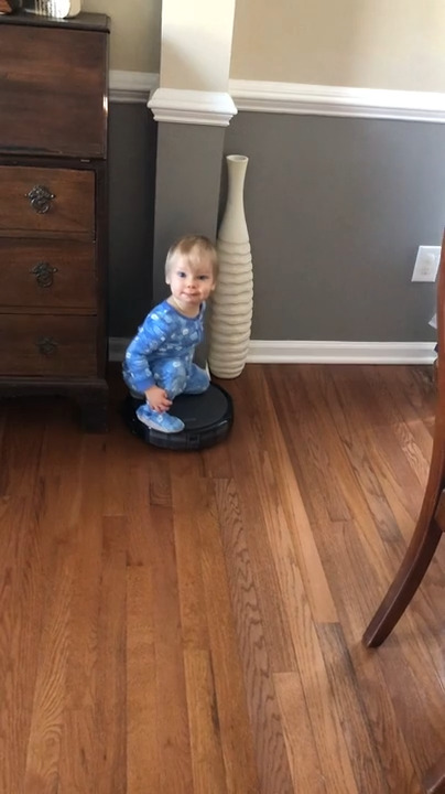 Toddler Enjoys Riding Robotic Vacuum Cleaner | Jukin Licensing
