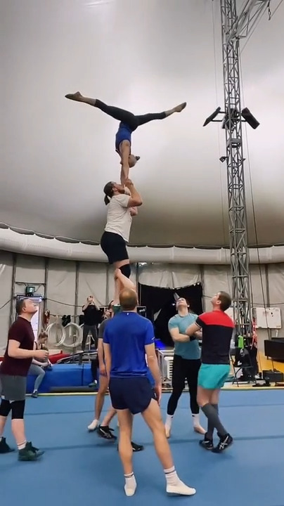 Gymnast Performs Backflip in Air and Does Handstand Over Another ...