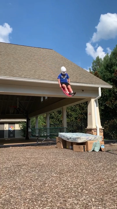 Kid Uses Sled to Slide off Roof Onto Small Mattress | Jukin Licensing