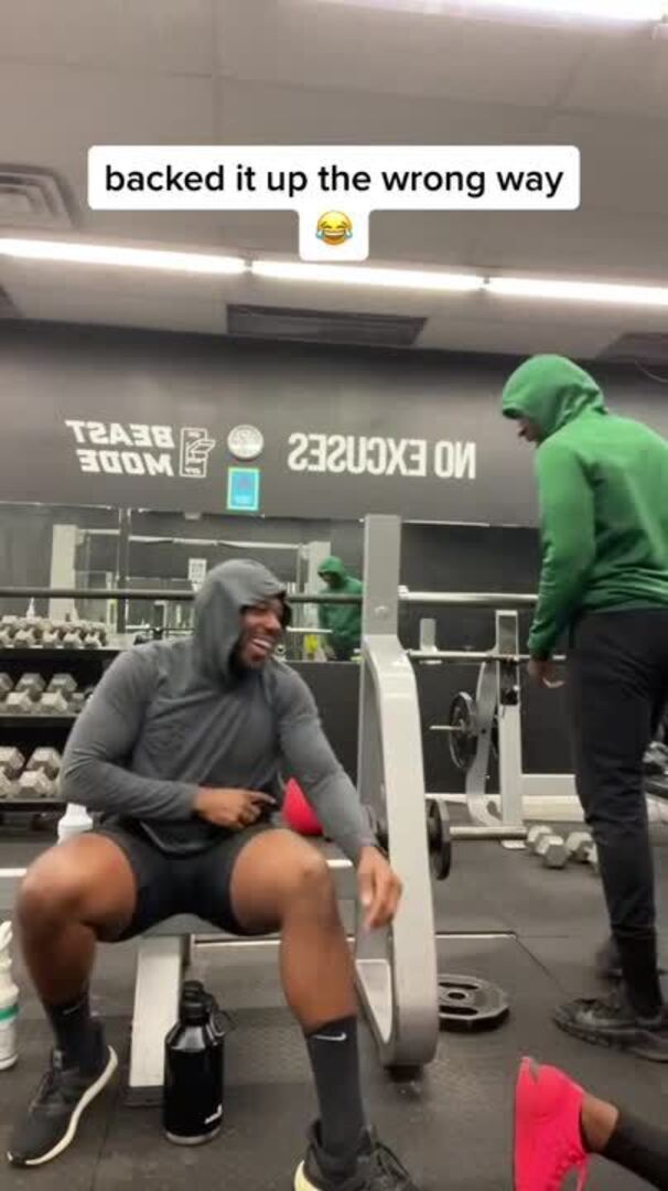 Backwards-moving Woman Trips and Falls Upon Man's Lap | Jukin Licensing