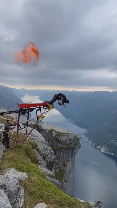 Guy Flips Off Catapult While BASE Jumping From Cliff | Jukin Licensing