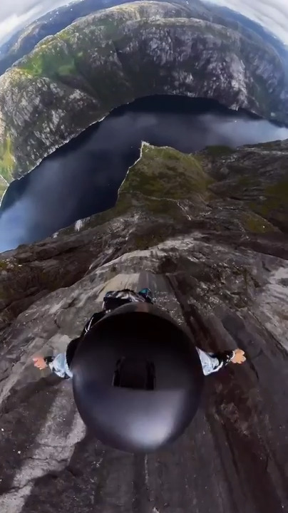 Guy Does BASE Jumping Off Cliff And Makes Smooth Landing on Rocky ...