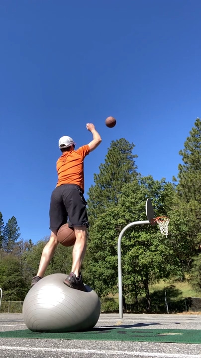 Guy Makes Multiple Basketball Shots While Balancing Himself Over ...