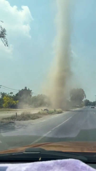Car Drives Past Small Dust Devil on Roadside | Jukin Licensing