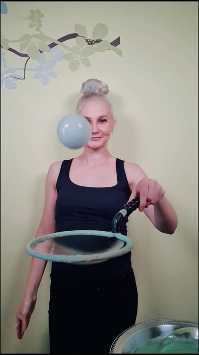 Woman Bounces Vapor Bubble on Soap Bubble Racket | Jukin Licensing