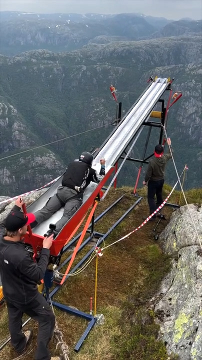 Person BASE Jumps Off Cliff in Norway | Jukin Licensing