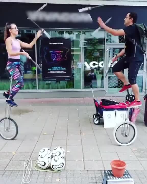 Couple Perform Amazing Knife juggling While Balancing on Unicycles ...