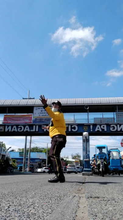Traffic Enforcers Dance Light Heartedly While Directing Heavy Traffic ...