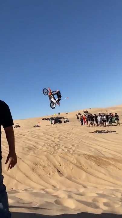 Guy Falls Off Dirt Bike After Attempting Jump Off Dune | Jukin Licensing