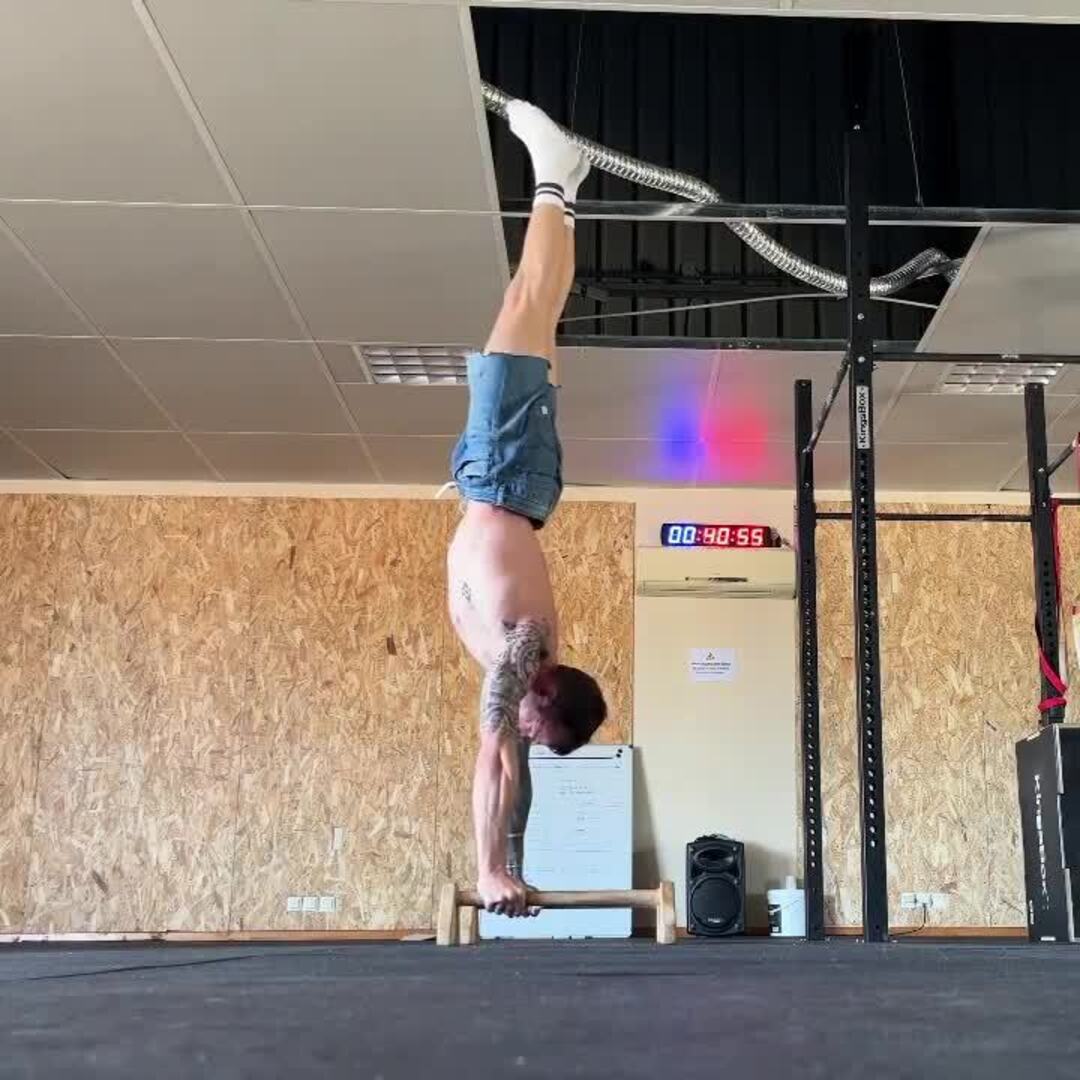 Personal Trainer Performs Handstand Pushups at the Gym | Jukin Licensing