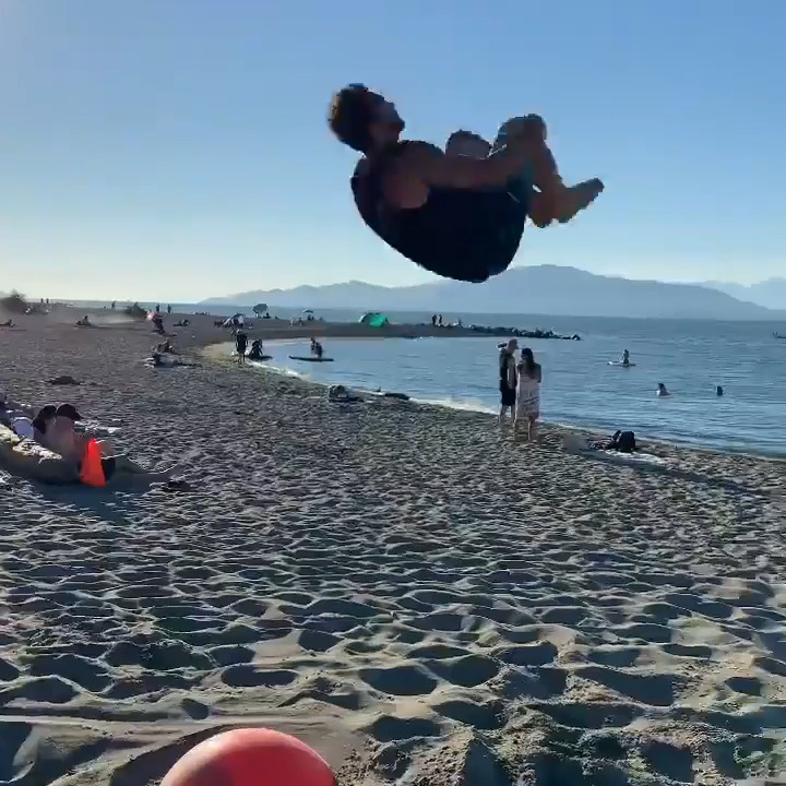 Guy Does Double Front Flip Off Ball at Beach | Jukin Licensing