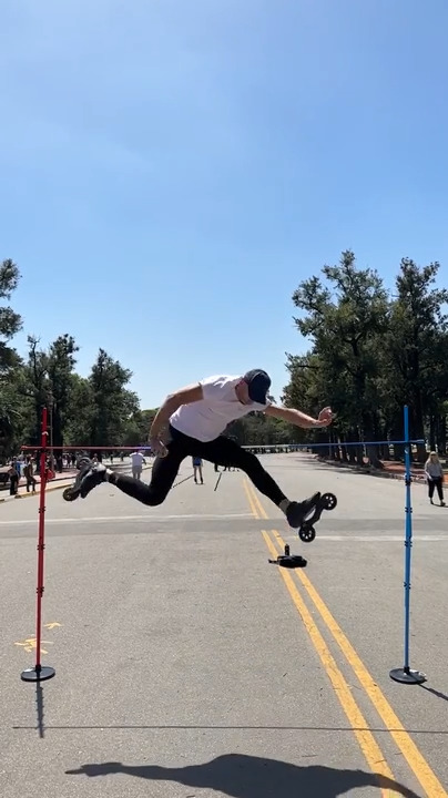 Guy Wearing Inline Blades Attempts Straddle Jump Over High Bar | Jukin ...