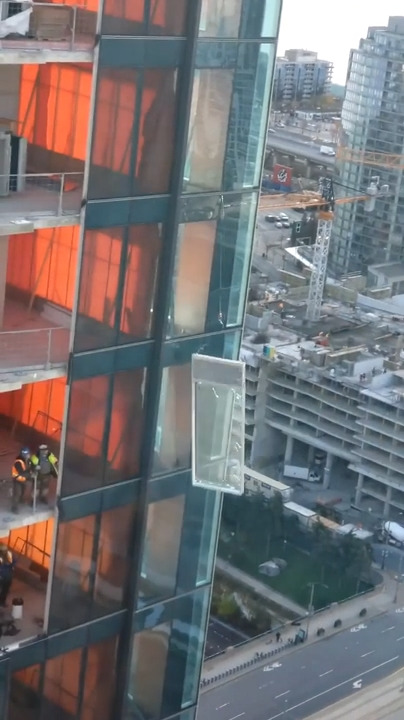 Workers Watch Glass Window Crashing Into Building Due to Strong Winds ...