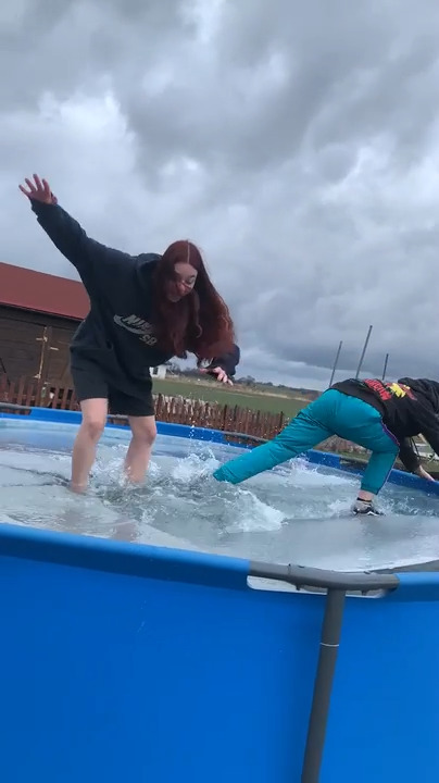Girls Fall Into Frozen Pool When One of Them Jumps on Ice | Jukin Licensing