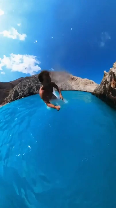Man Backflips off Cliff Into Pristine Blue Water | Jukin Licensing