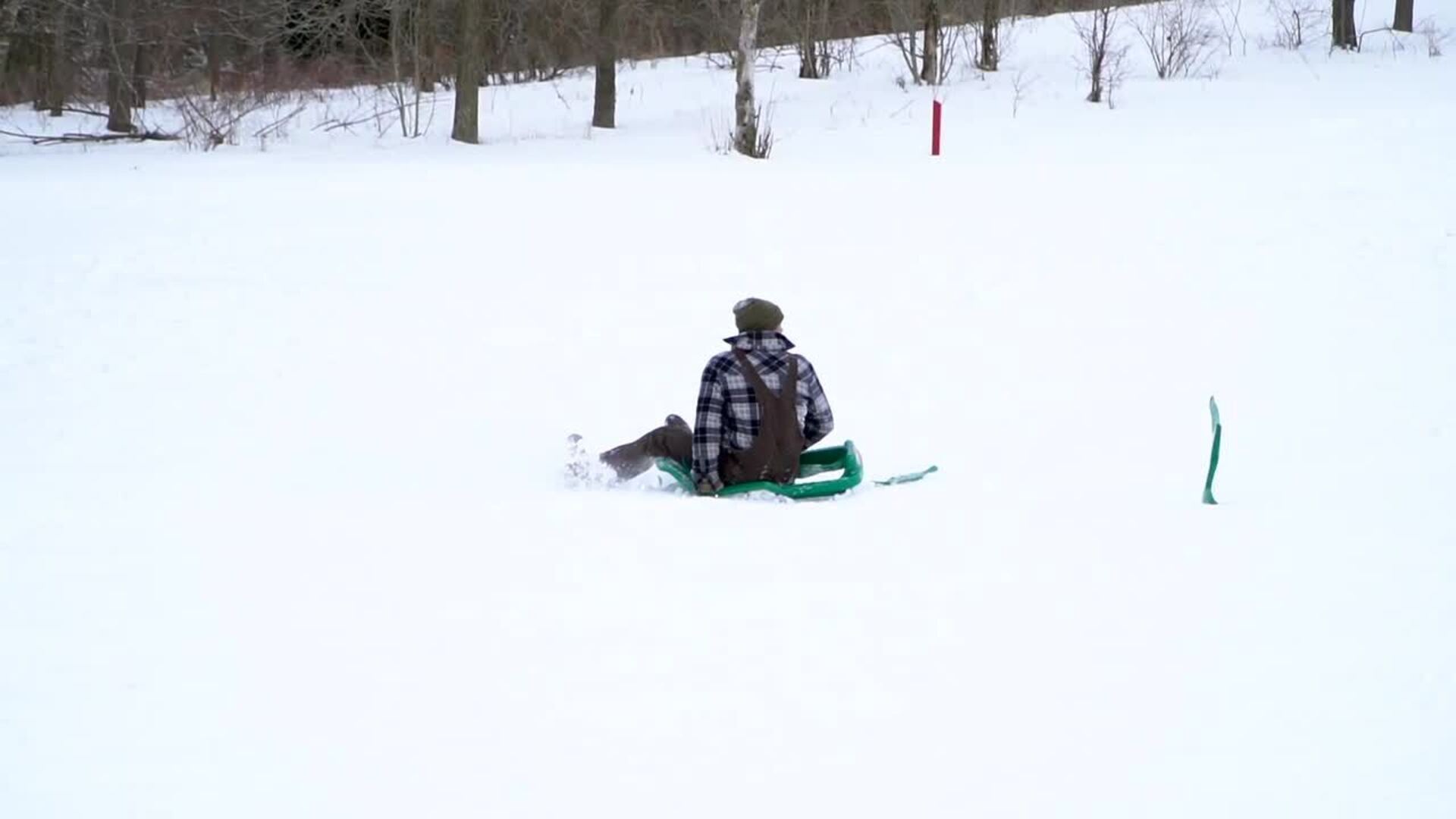 Guy Breaks Sled While Sliding Down Snowy Slope | Jukin Licensing