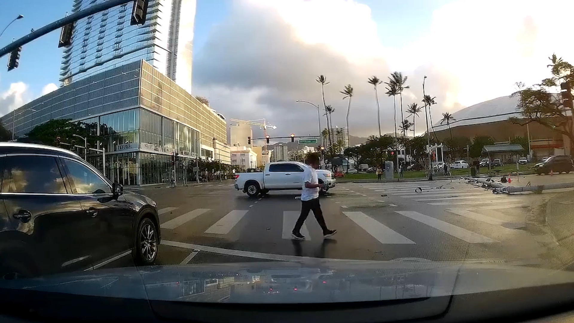 Traffic Light Falls on Road and Narrowly Misses Vehicle Passing by ...