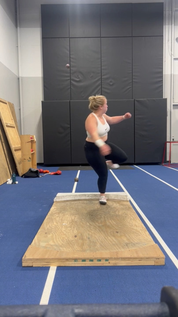 Shot Put Ball Ricochets off Wall and Falls on Thrower's Backpack ...