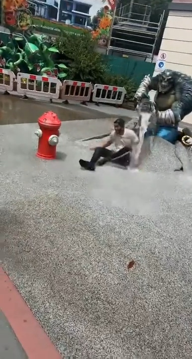 Guy Collides With Statue and Falls While Running Through Water Fountain ...