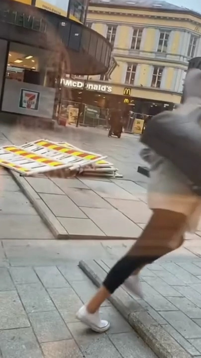 Multiple People Stumble Over Unnoticed Ledge While Walking on Street ...