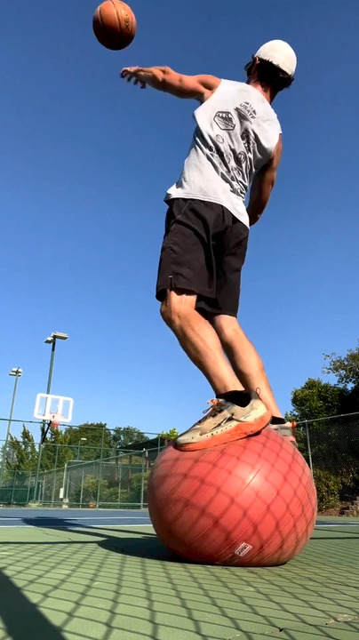 Guy Balancing Himself on Stability Ball Makes Basketball Trickshots ...