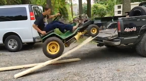 Guy Almost Falls While Unloading ATV Off Truck | Jukin Licensing