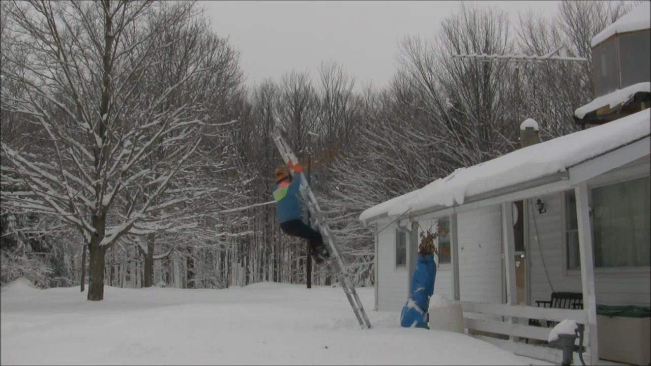 Guy Removing Snow From Roof Falls Off Ladder | Jukin Licensing