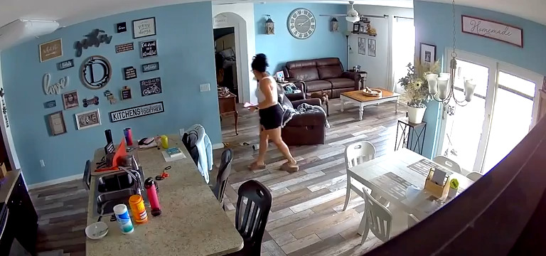 Woman Busy on Phone Loses Footing and Crashes Into Table | Jukin Licensing