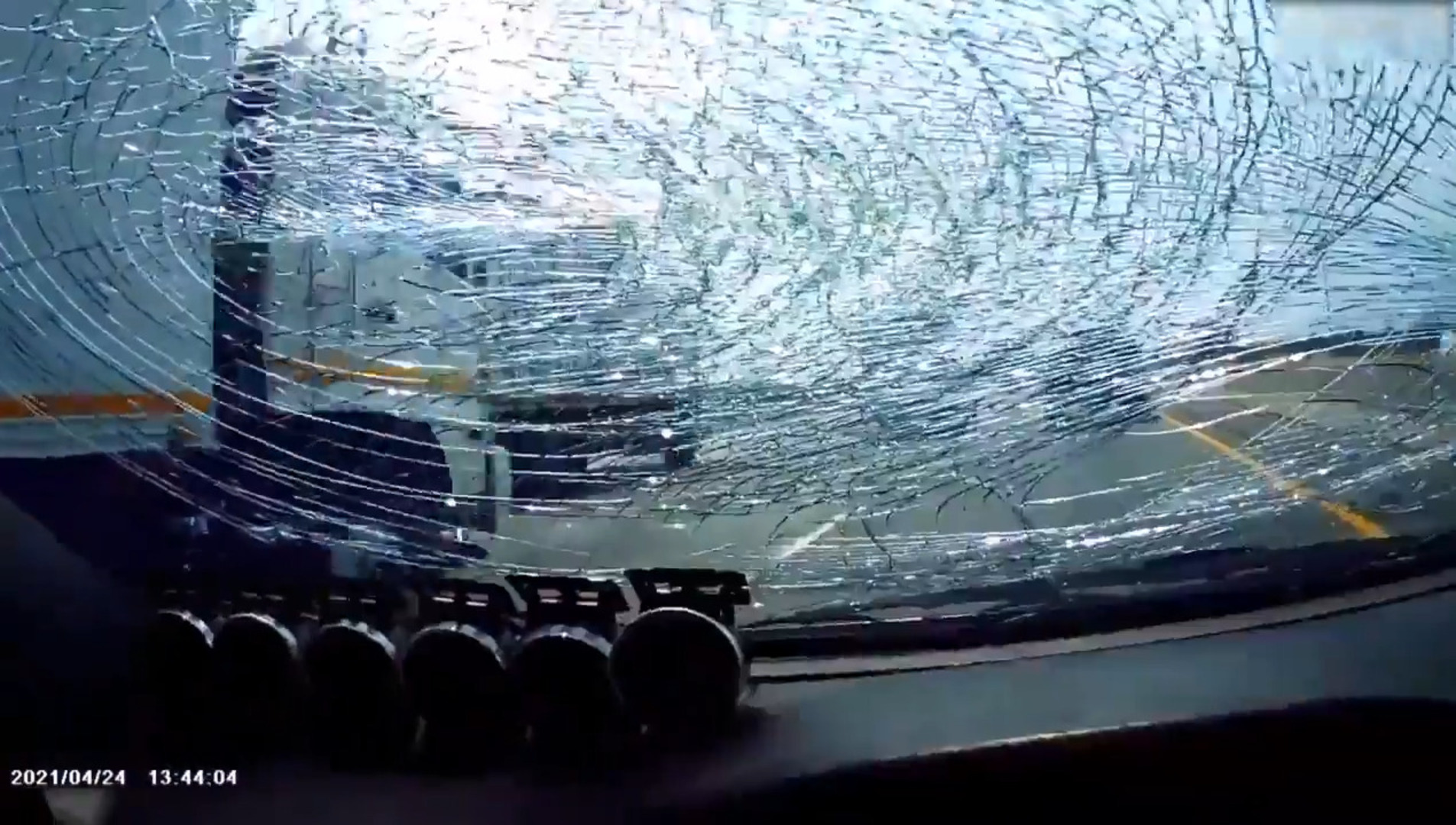 Truck Tire Flings Road Debris Through Car Windshield | Jukin Licensing