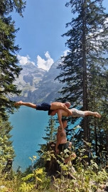 Trio of Men Create Acrobatic Formation on Stump at Scenic Location For ...
