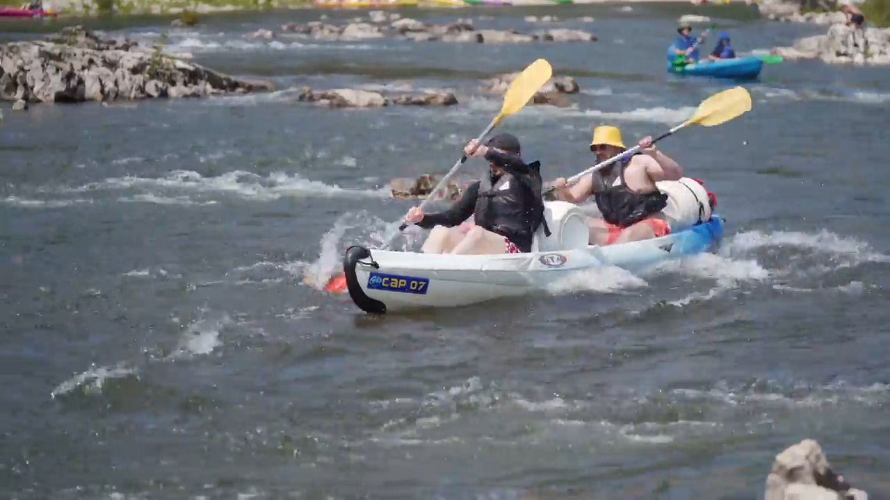 Duo Riding Canoe Through Rapid Falls Into Water | Jukin Licensing