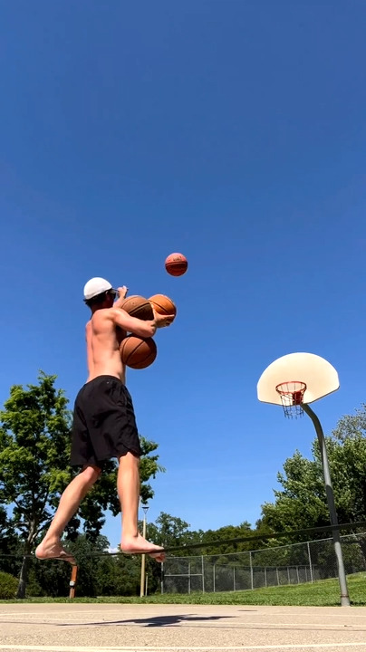 Guy Makes Basketball Trick Shots While Balancing Himself Over Slackline ...