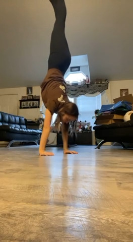 Girl Practicing Handstands in Living Room Falls Down Hilariously ...