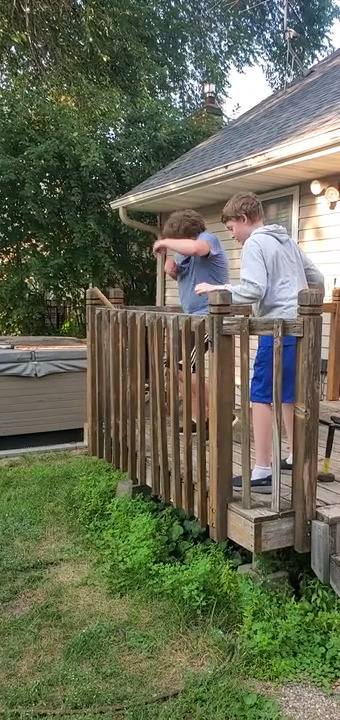 Boy Swinging Hammer to Break Wooden Railing Hits Himself in Head With ...