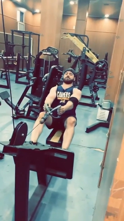 Guy Performing Back Exercise on Gym Equipment Falls When Cable Snaps ...