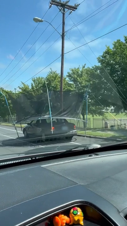 Car Driving With Upside Down Trampoline on Its Roof | Jukin Licensing