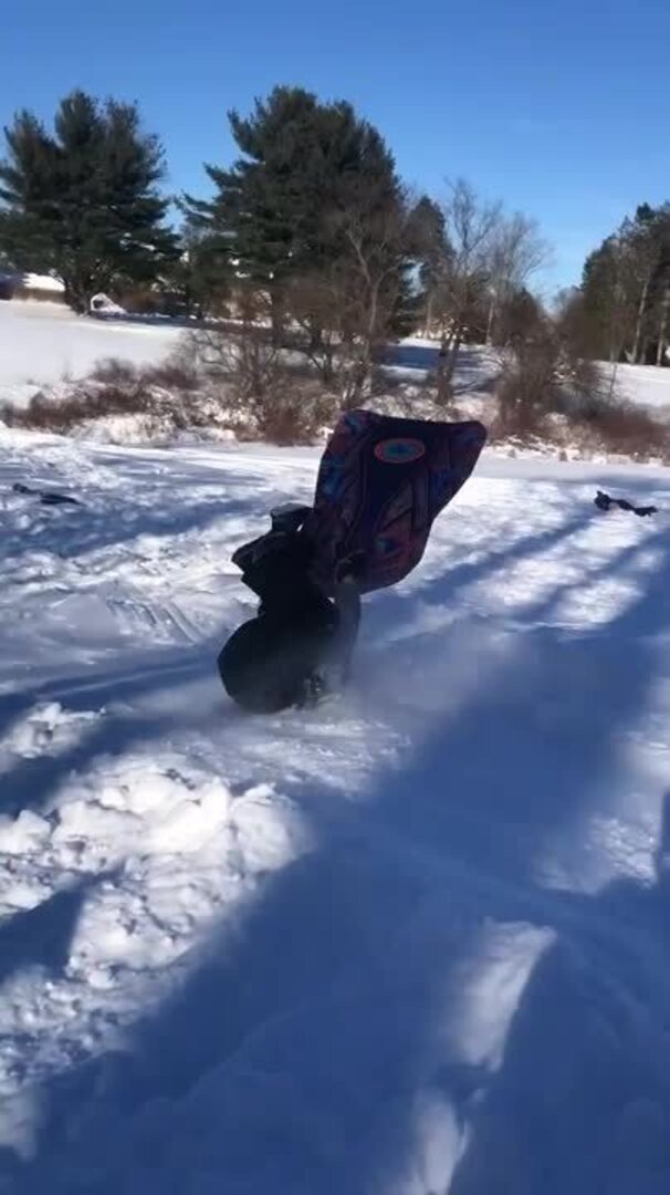 Boy Falls Out of Sled While Sledding Downhill | Jukin Licensing