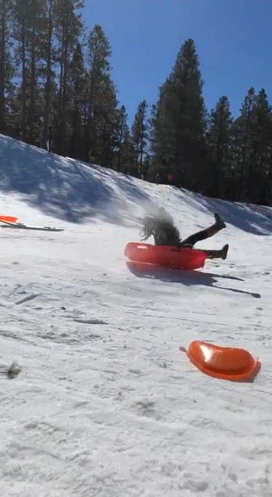 Girl on Sled Loses Control and Crashes Into Ice Block | Jukin Licensing