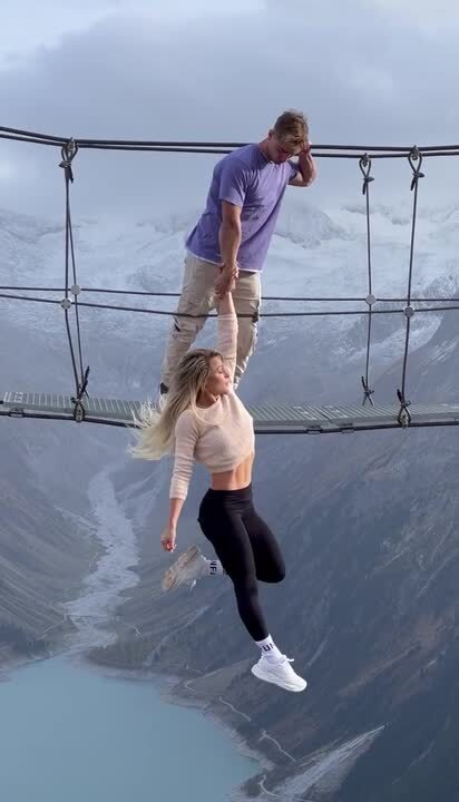 Couple Perform Daring Acrobatic Stunt on Suspension Bridge | Jukin ...