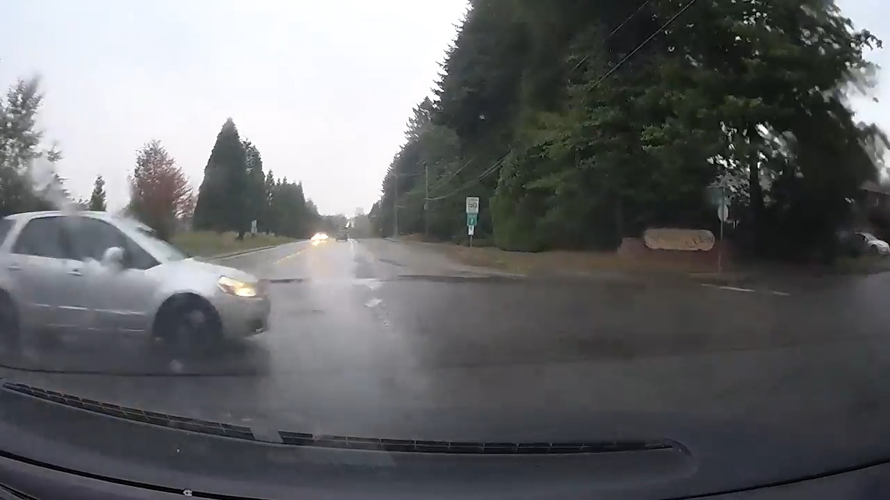 Driver Swerves to Avoid Collision With Car at Intersection | Jukin Licensing