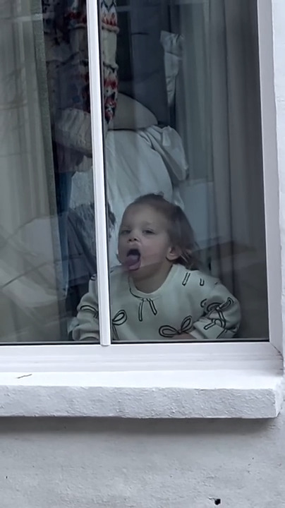 Toddler Licks Window and Makes Funny Faces | Jukin Licensing