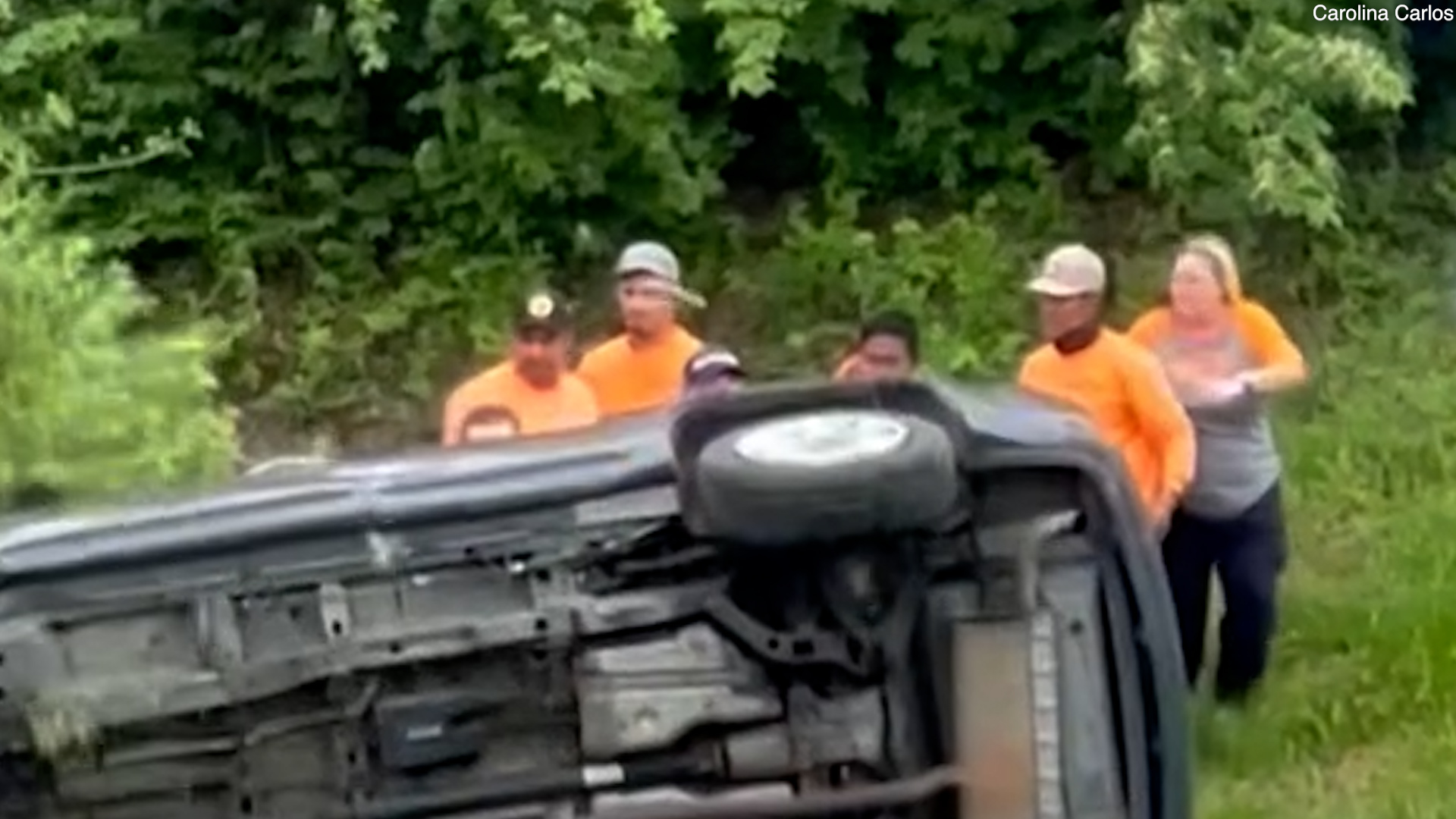 Group of Strangers Save Trapped Woman After Her Car Flips Over | Jukin Licensing