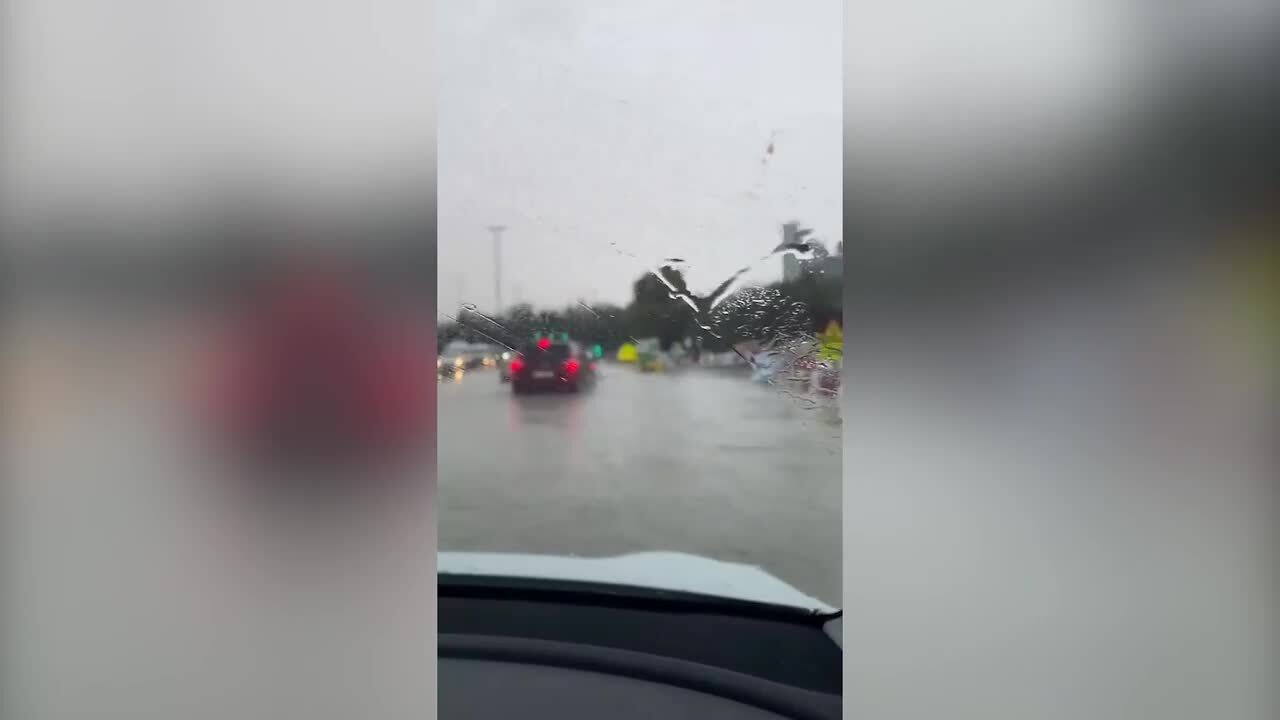 Electric Car Drives Through Flooded Road in Dubai | Jukin Licensing