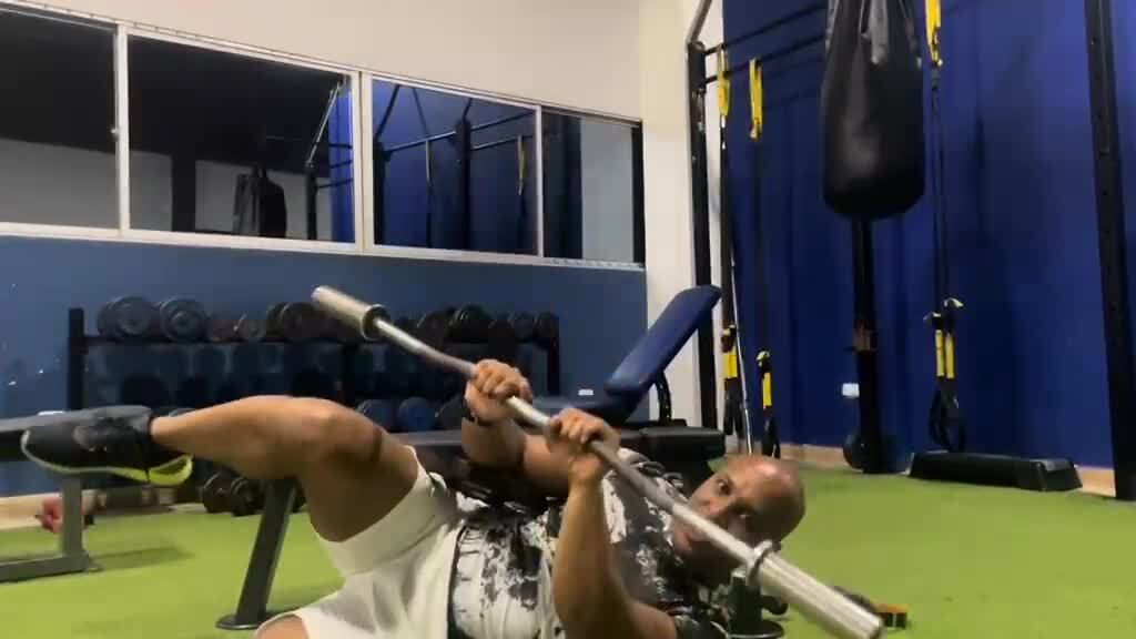 Man Attempting Barbell Exercise Fails to Position Himself on Bench ...