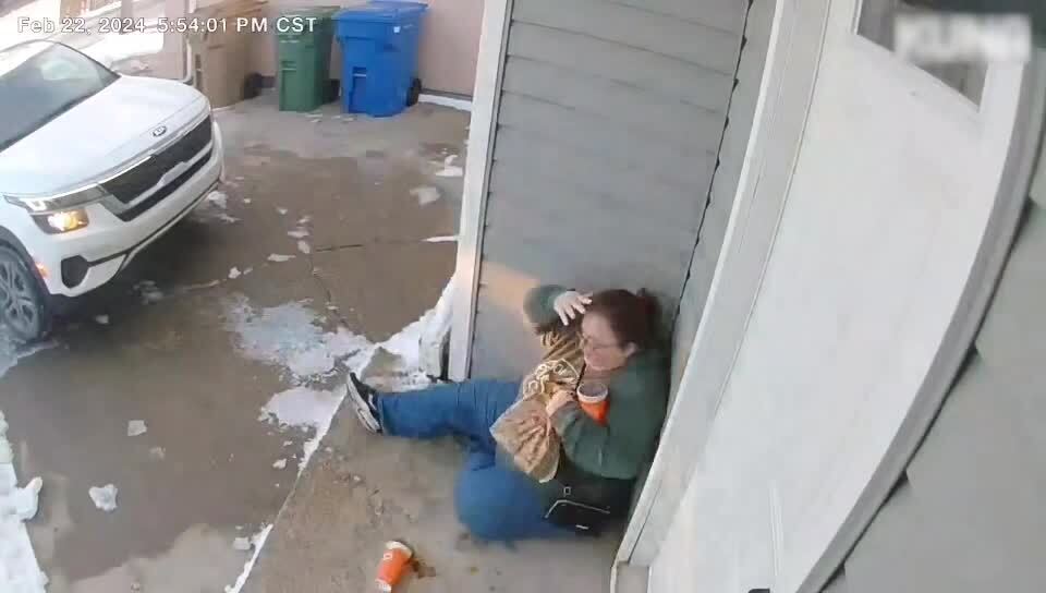 Woman Loses Footing on Ice and Crashes Into Wall | Jukin Licensing