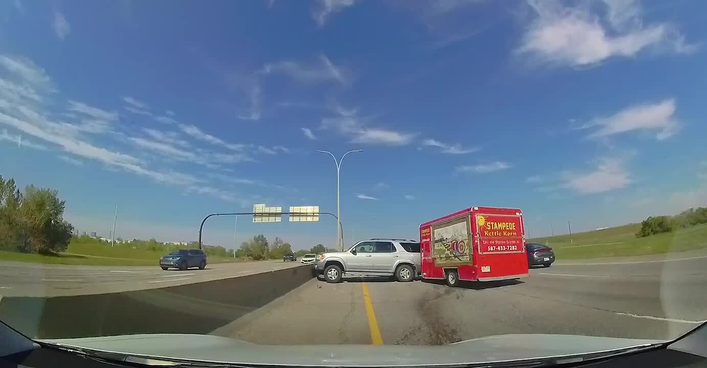 Person Watches SUV Carrying Trailer Swerve Around on Highway | Jukin ...