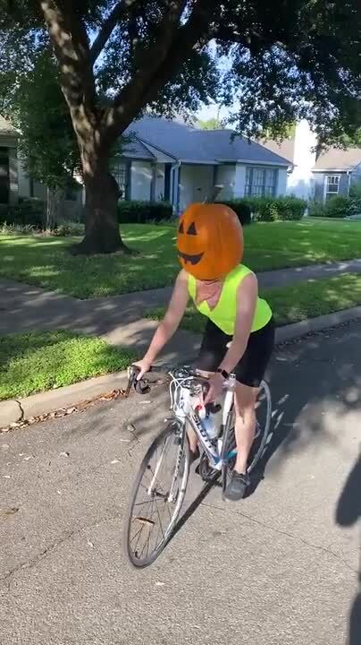 Person Falls Off While Riding Bike With Pumpkin Head on | Jukin Licensing