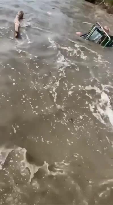 Woman Sitting in Beach Chair on Edge of River Gets Pushed Into Water by ...