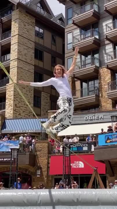 Woman Balances on Slack Line In Middle of Road | Jukin Licensing