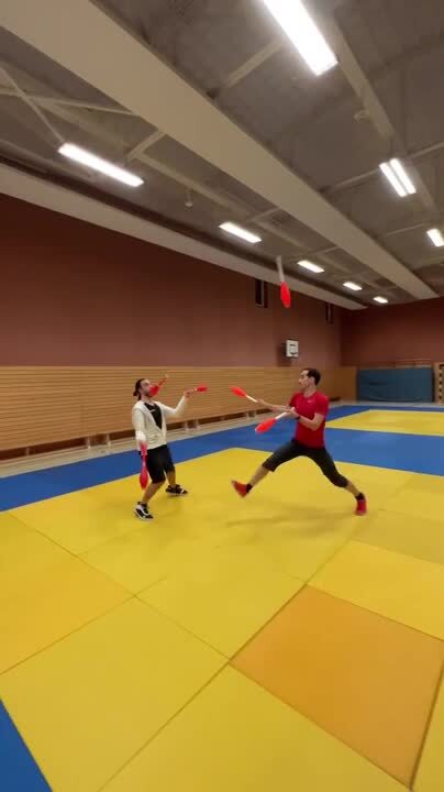 Two Jugglers Compete in Three-Club Combat | Jukin Licensing